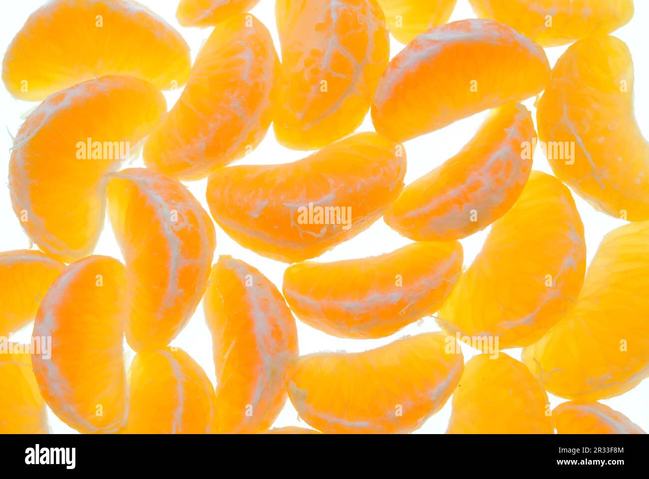 Groups of segments of a tangerine Stock Photo - Alamy