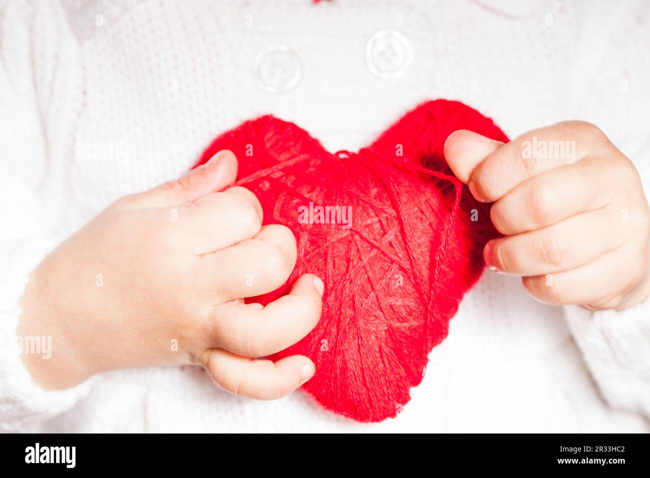 Knitted white heart in hi-res stock photography and images - Alamy