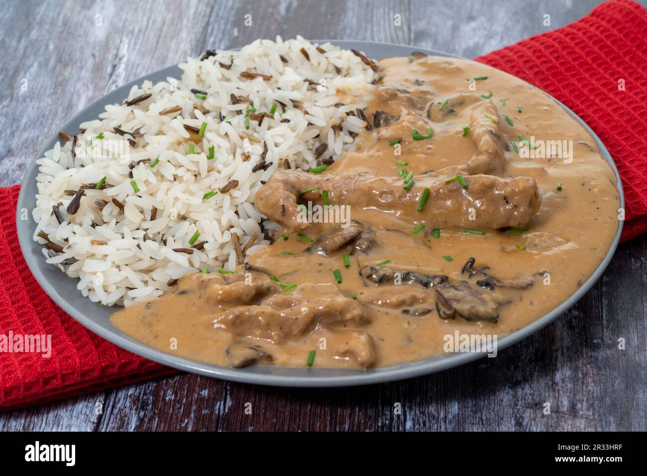Beef stroganoff and wild rice Stock Photo - Alamy
