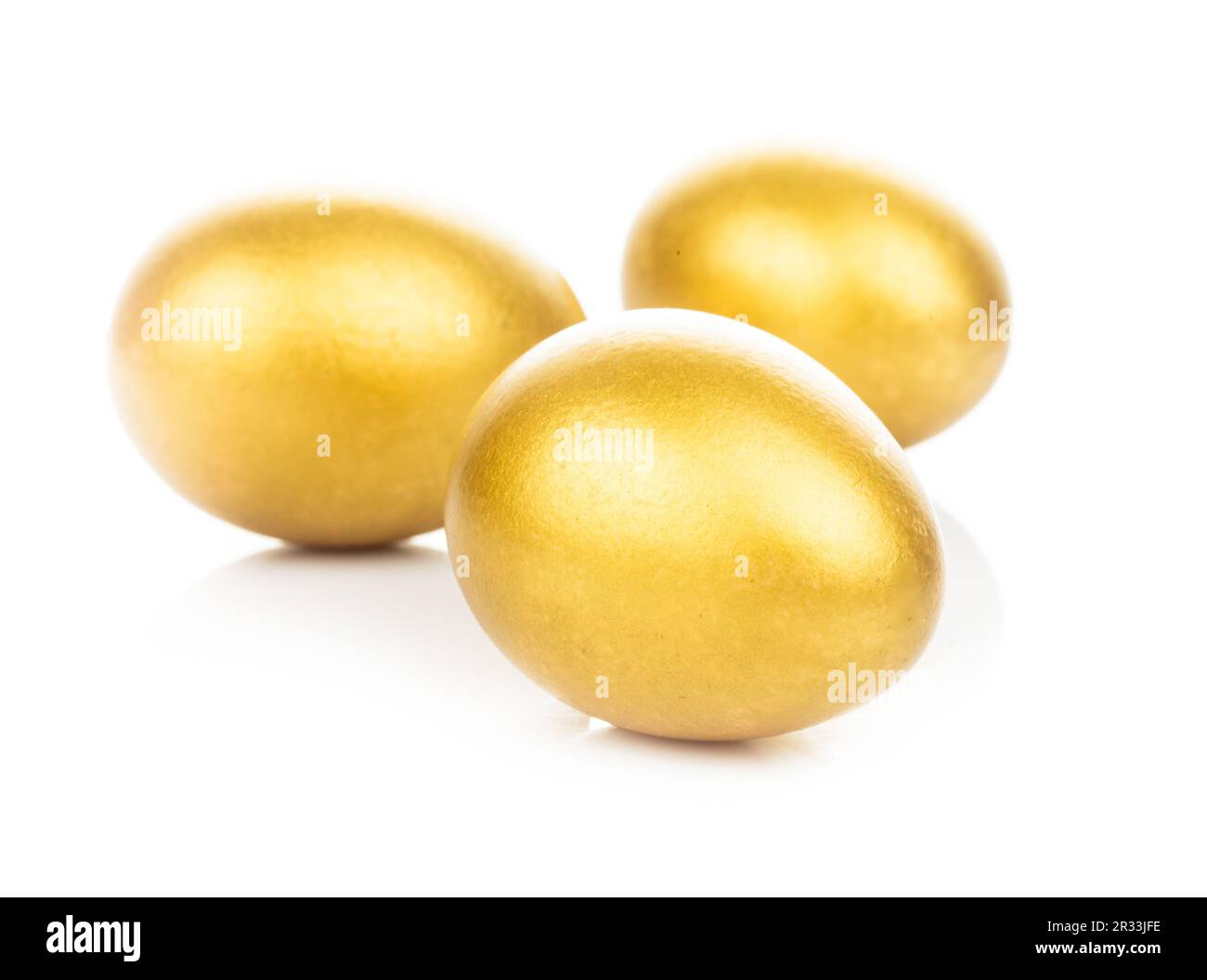 Golden eggs isolated Stock Photo - Alamy