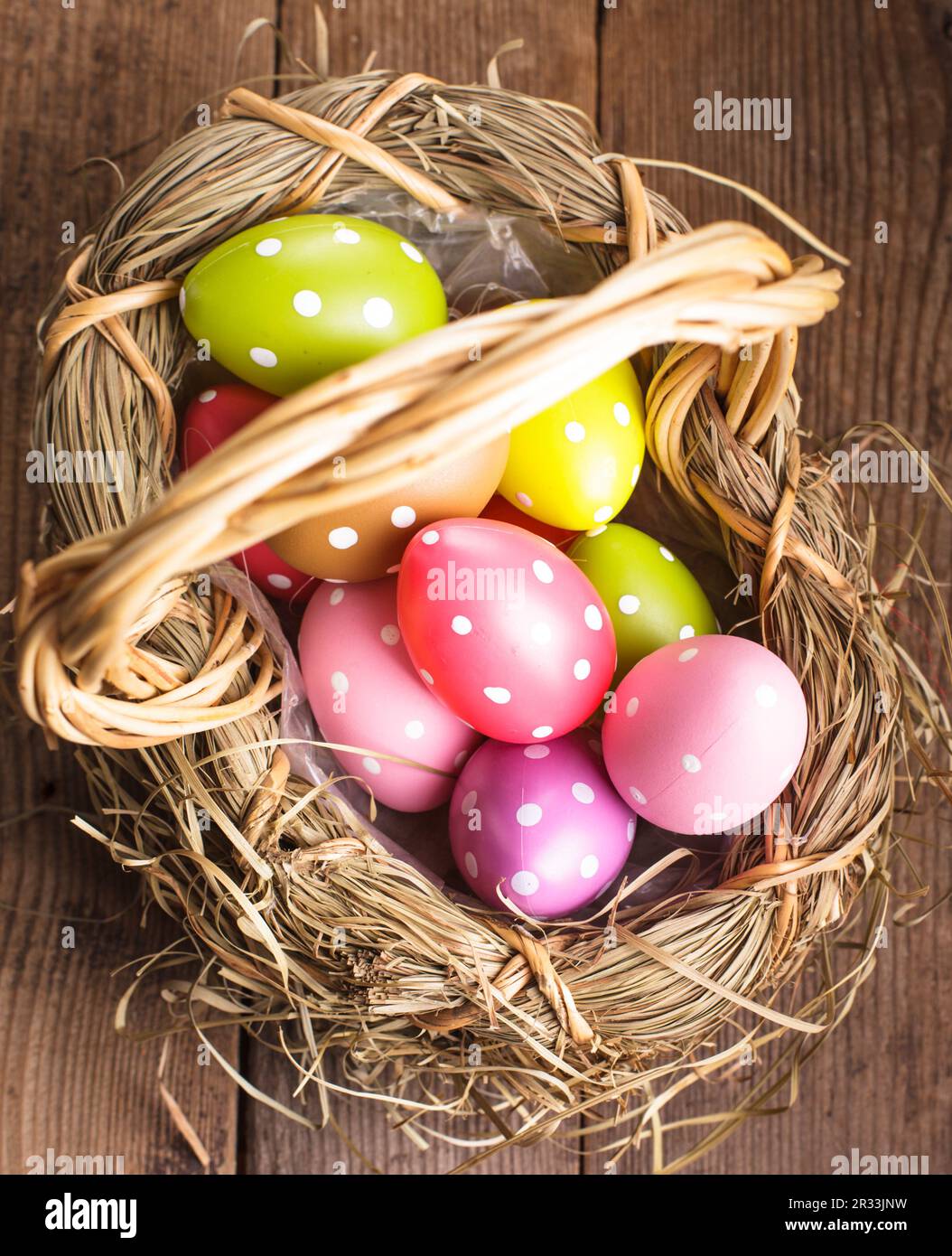Easter eggs in basket Stock Photo - Alamy