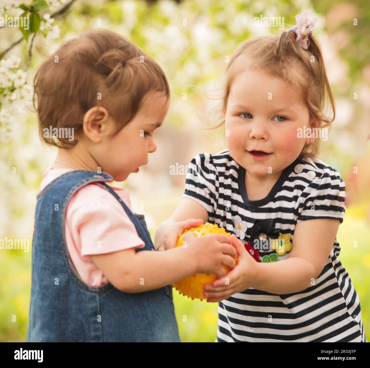 Two happy children garden hi-res stock photography and images - Alamy