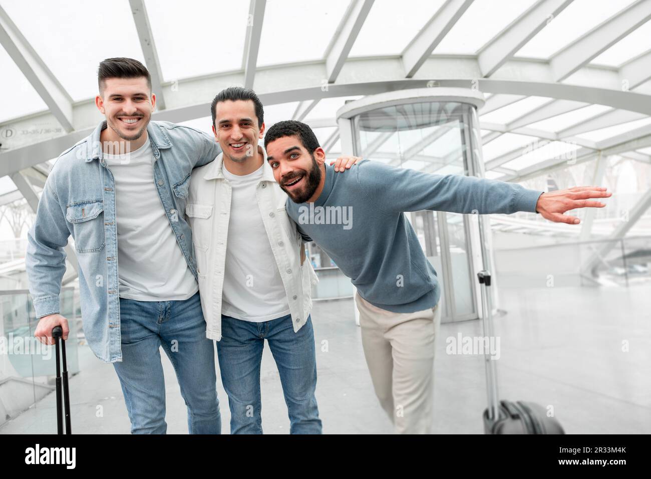 Group Of Friends Guys Posing Embracing In Airport Departure Terminal ...