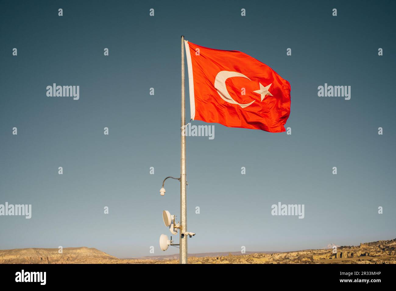 The Turkish flag in Cappadocia. The Turkish flag waving in the wind ...