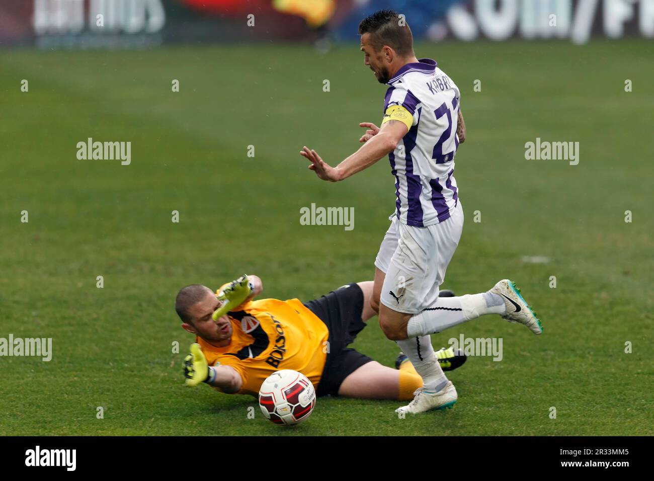 BUDAPEST, HUNGARY - MARCH 23, 2014: Peter Kabat of Ujpest (r) is ... BUDAPEST, HUNGARY - MARCH 23, 2014: Peter Kabat of Ujpest (r) is ...
