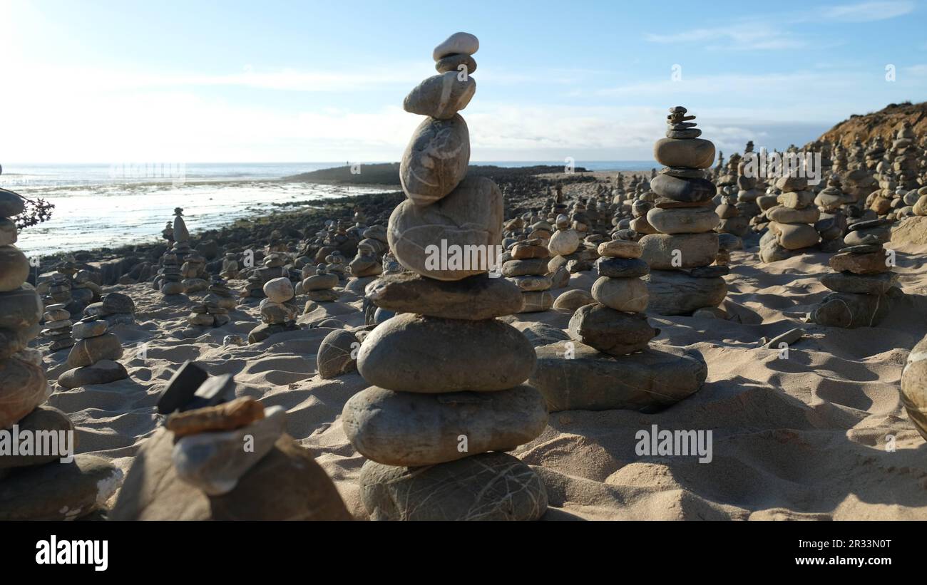 Round stones sculptures is the beach Stock Photo - Alamy
