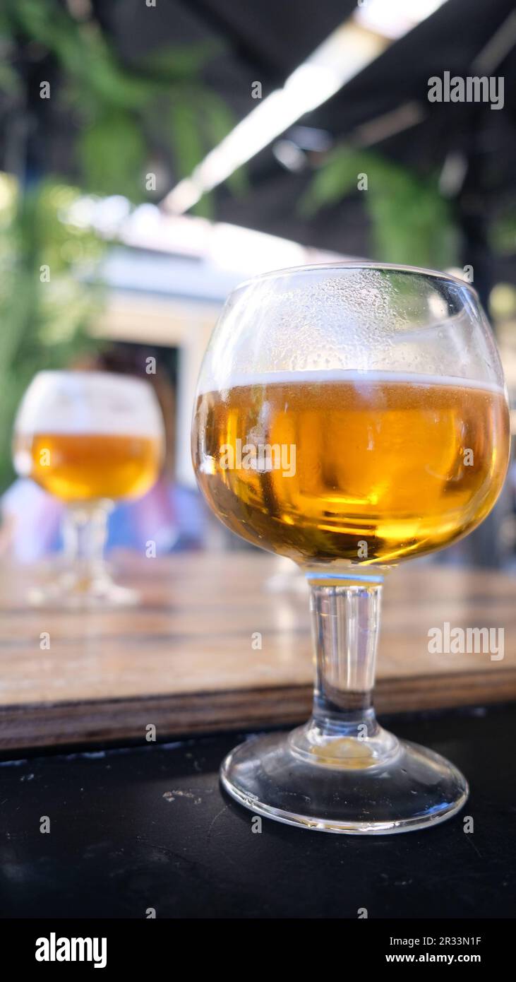 Beer in two round glasses Stock Photo - Alamy