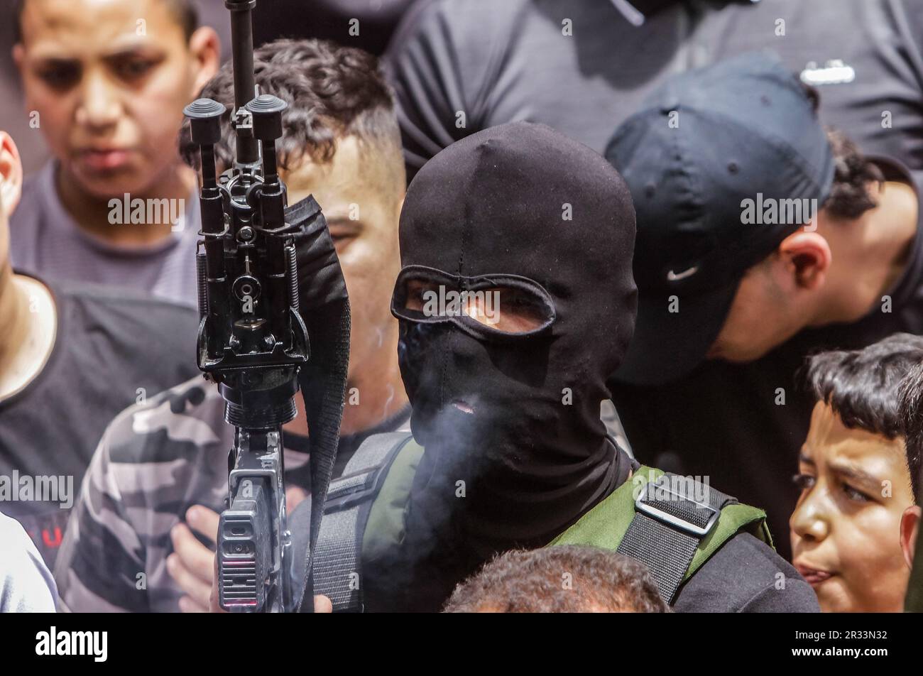 Nablus, Palestine. 22nd May, 2023. A masked gunman seen smoking during ...