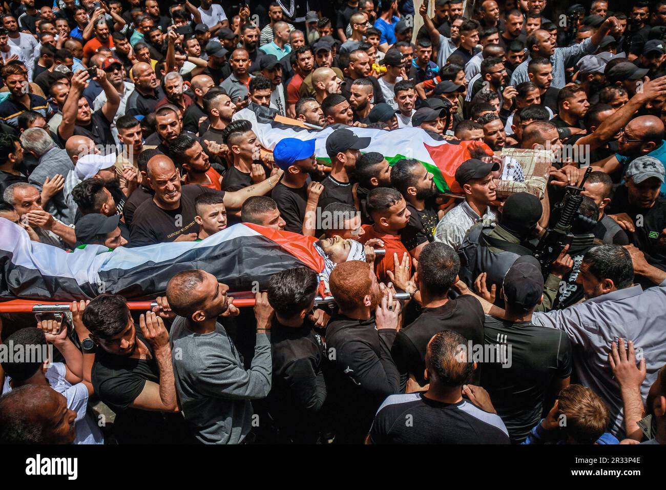 (EDITORS NOTE: Image depicts death)Mourners carry the body of the three ...