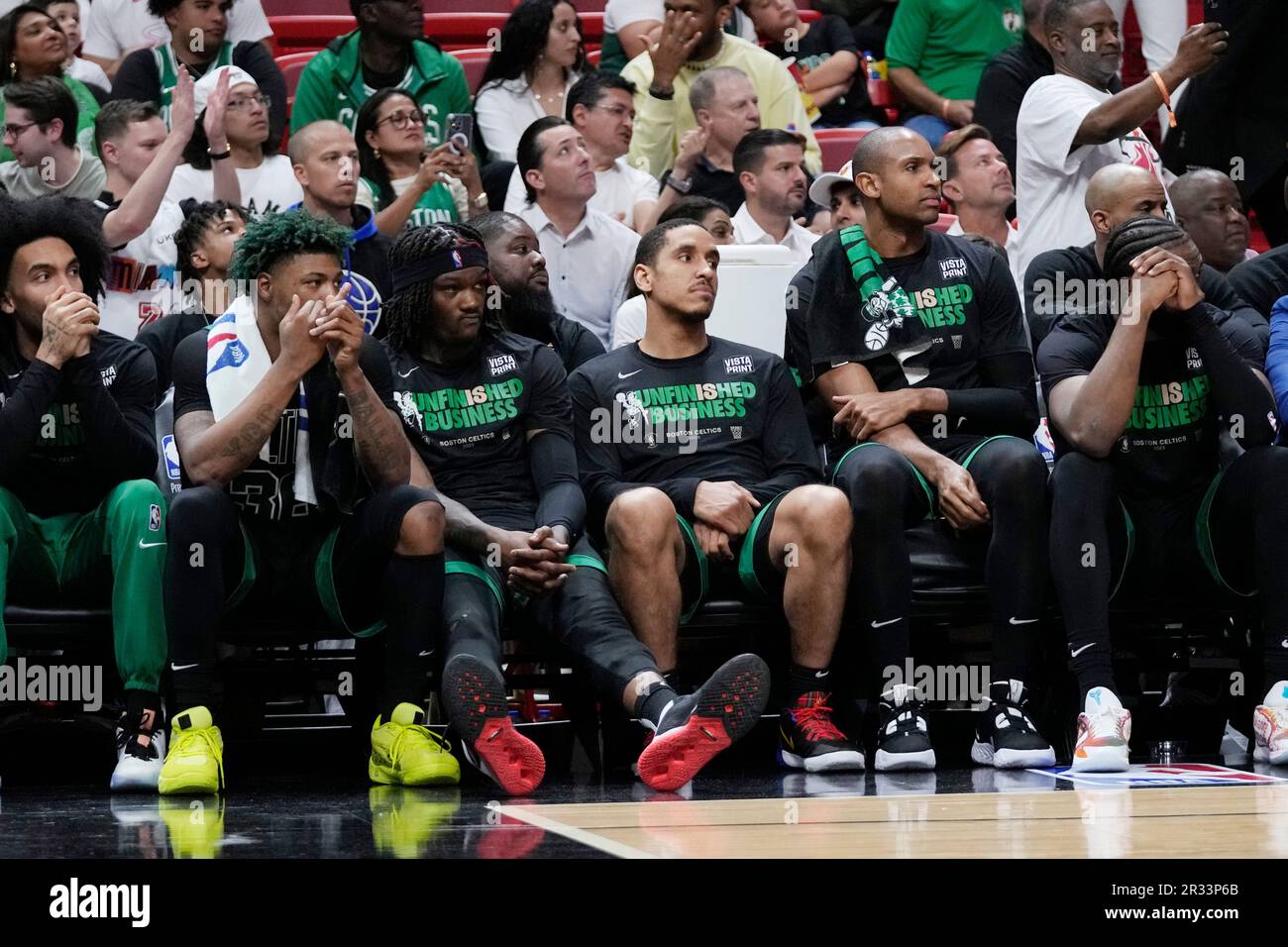 Boston Celtics players sit dejected as they fall behind the Miami Heat ...