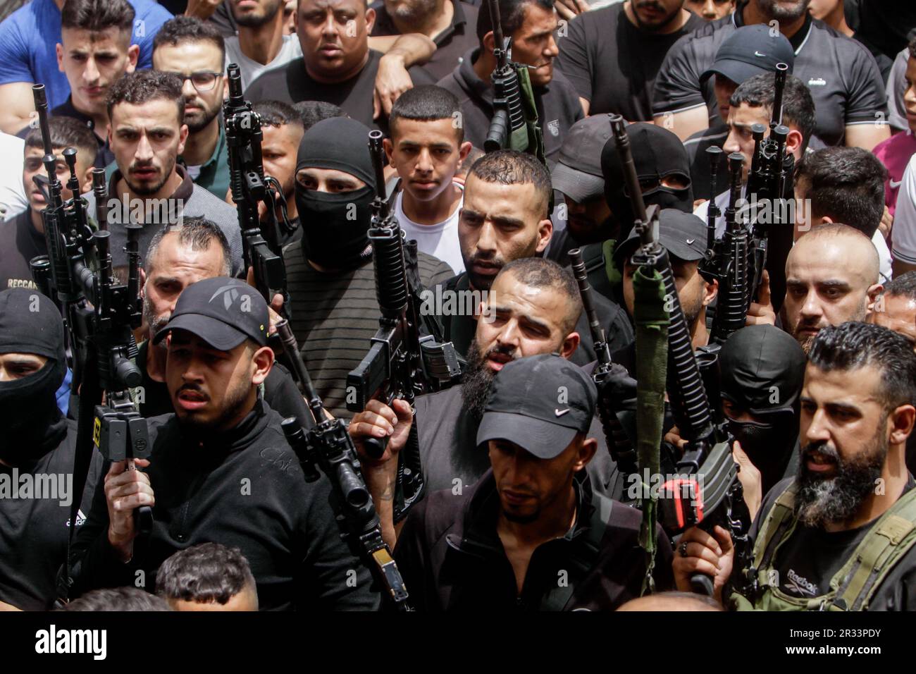 Gunmen take part in the funeral of the three Palestinians who were ...