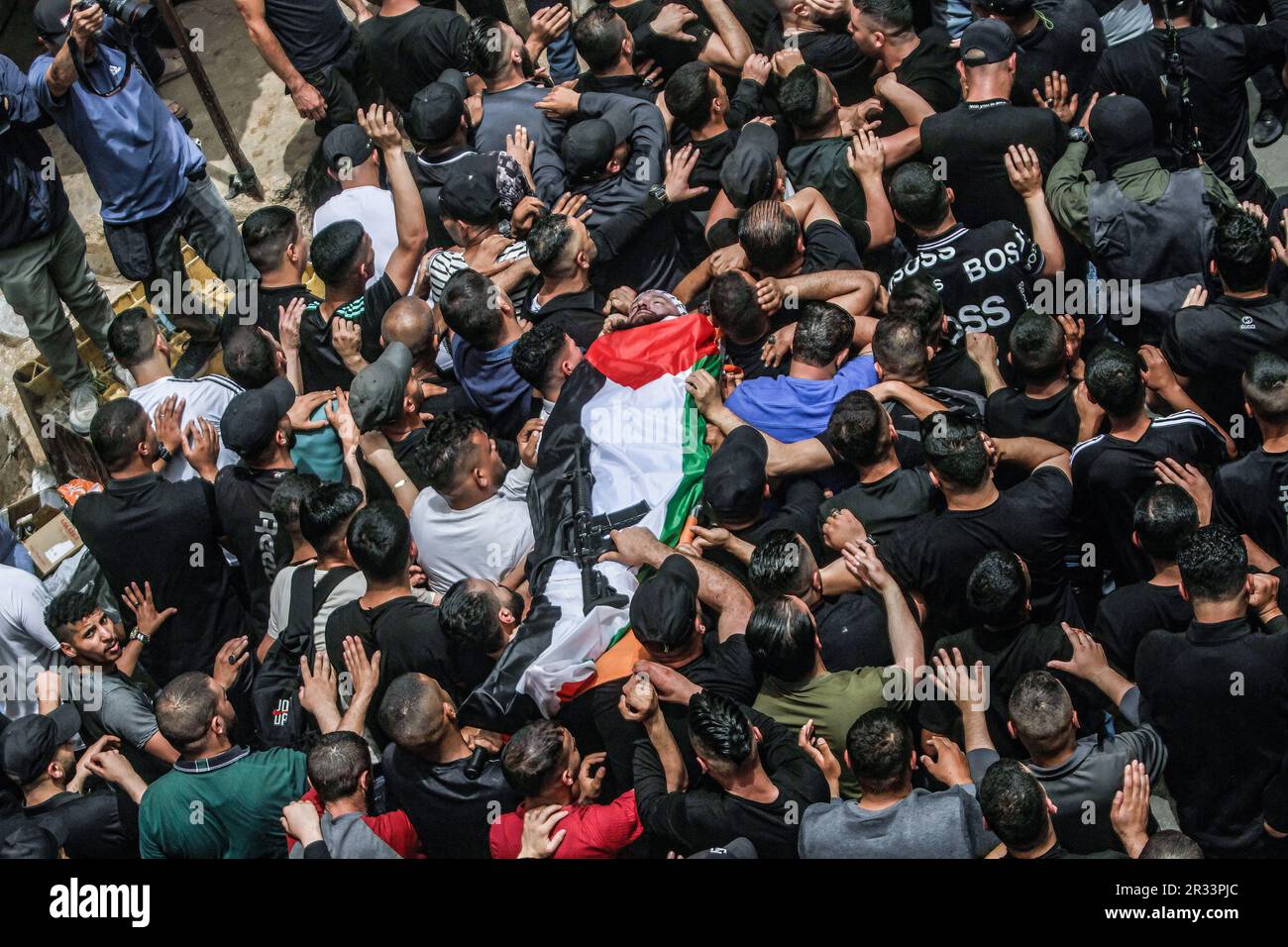 (EDITORS NOTE: Image depicts death)Mourners carry the body of one of ...