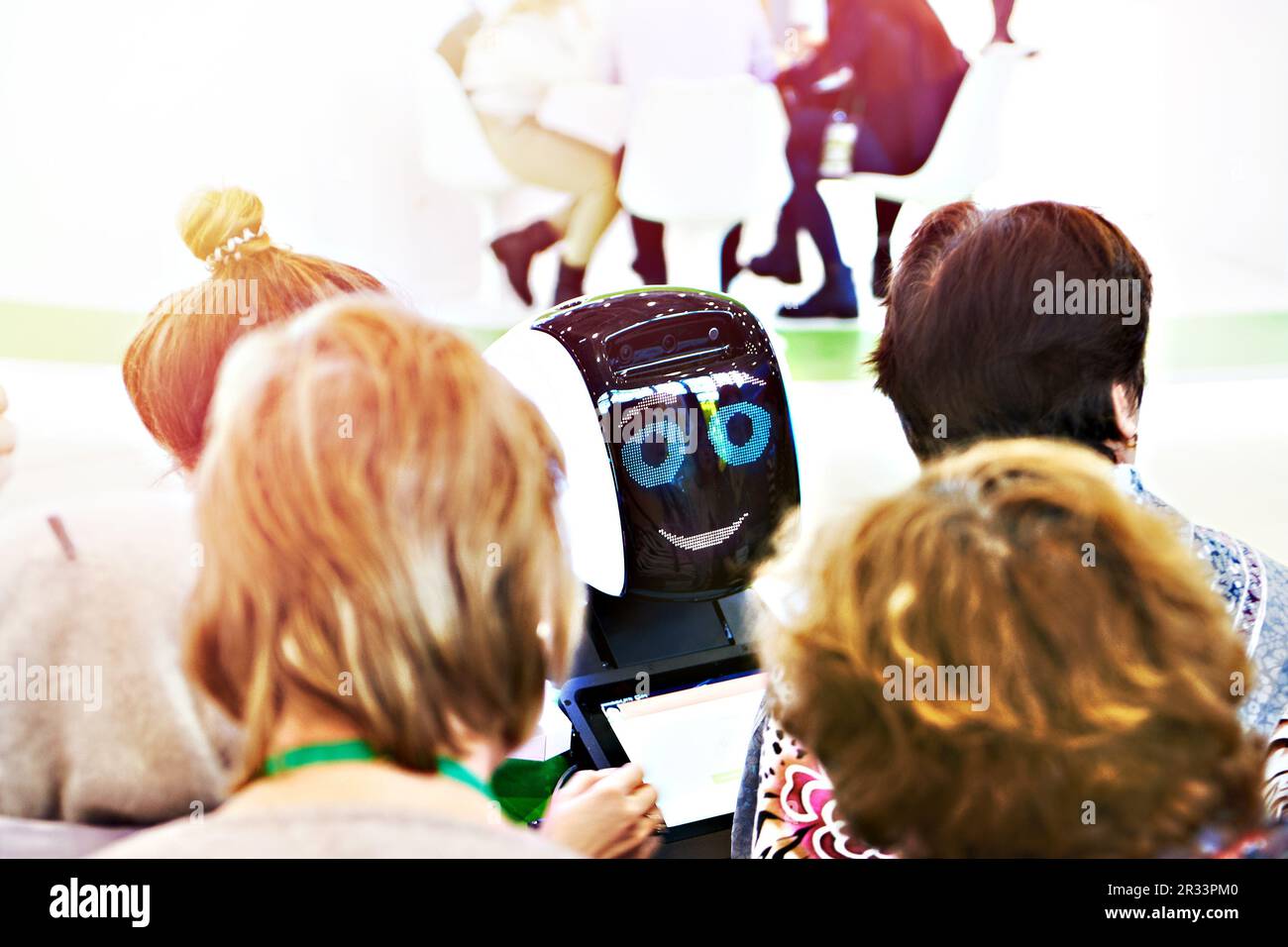 Robot information assistant among people at the exhibition Stock Photo ...