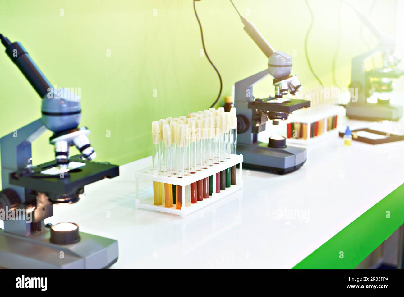 Medical microscopes and samples of biofluids in test tubes Stock Photo ...