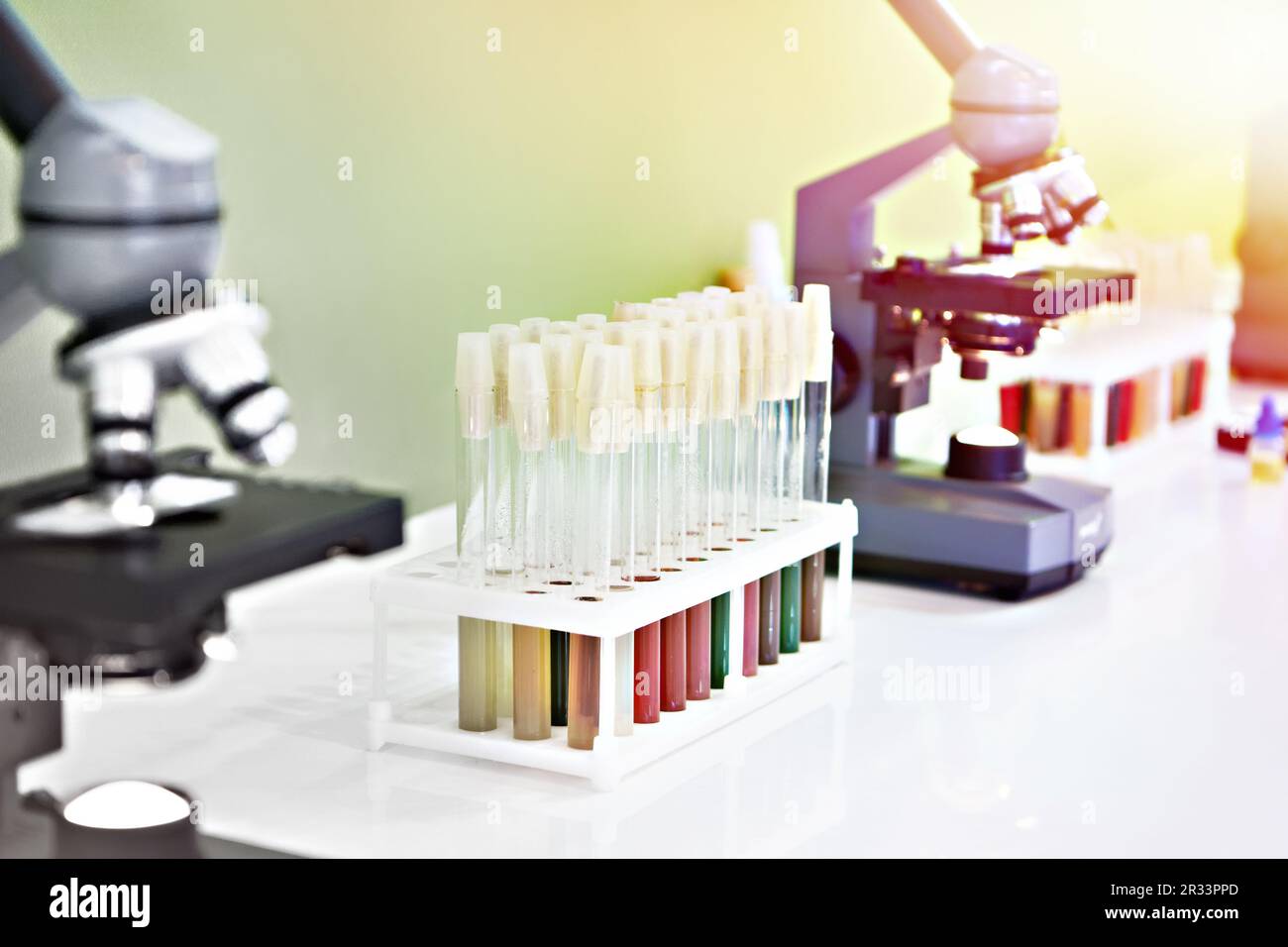 Medical microscopes and samples of biofluids in test tubes Stock Photo ...