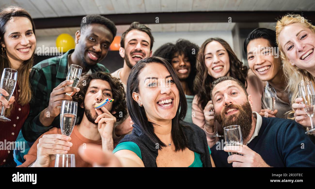 Multi ethnic friends having fun during birthday party - Young people looking camera during ...