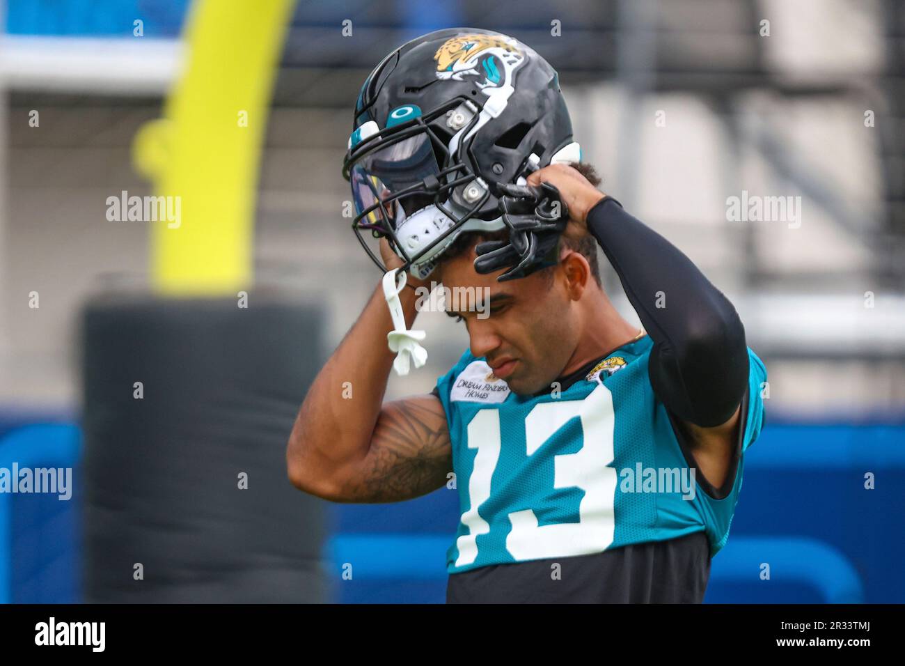 Jacksonville Jaguars wide receiver Christian Kirk (13) puts on his helmet during the NFL ...