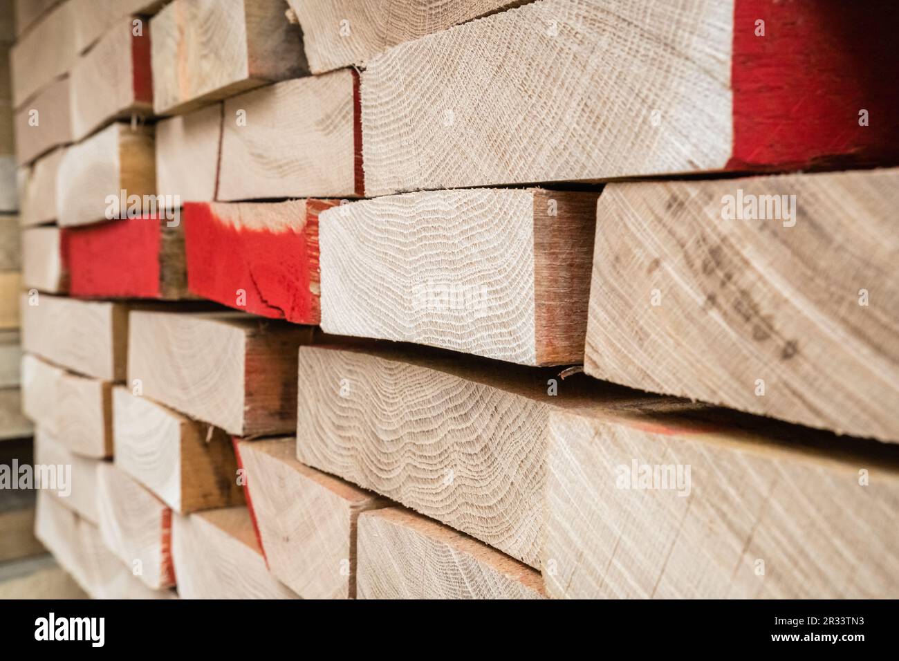 Stacks of lumber being stored in a warehouse Stock Photo - Alamy