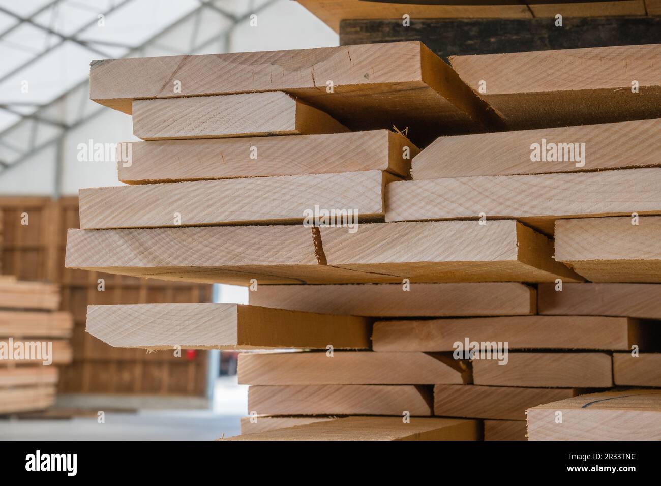 Stacks of lumber being stored in a warehouse Stock Photo - Alamy