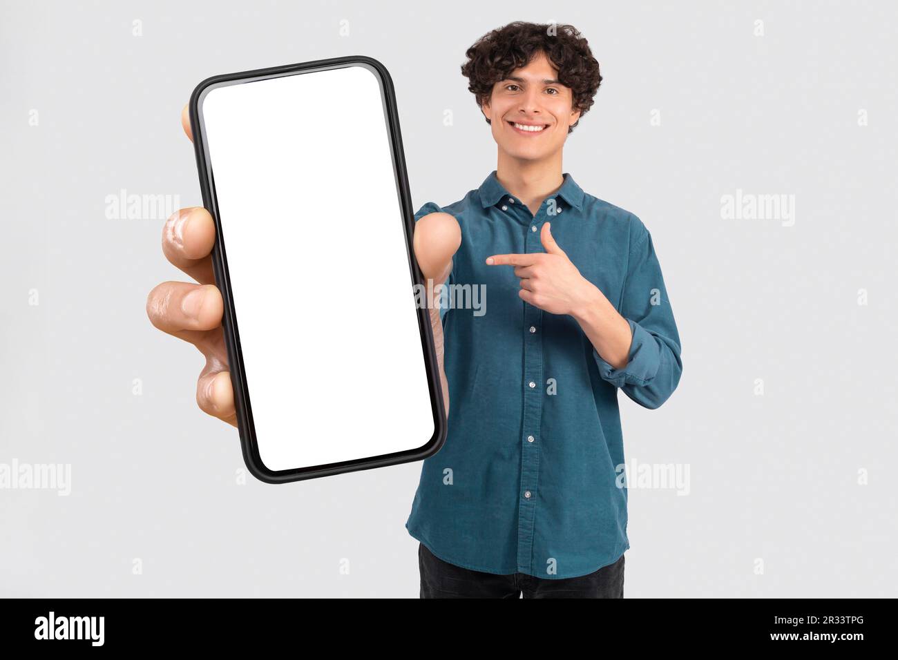 Cheerful Man Showcasing Enormous Big Cellphone Screen On White ...