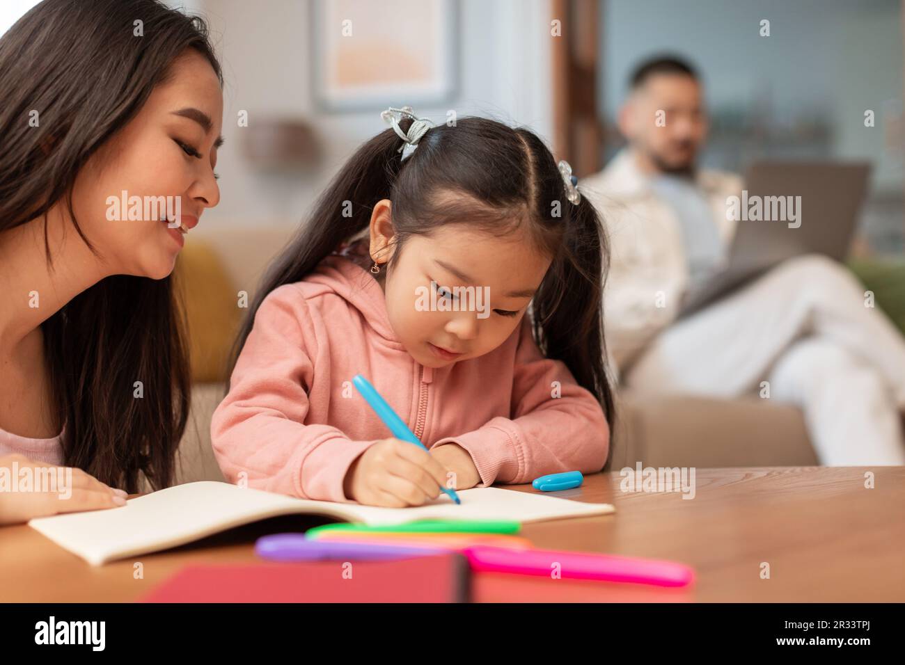 Korean Mother Teaching Little Daughter Writing Skills At Home Stock ...