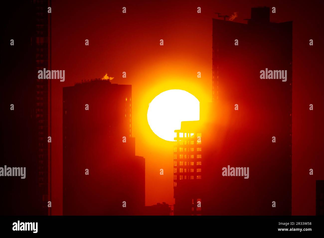 View of the sunset over Lower Manhattan from a window in Williamsburg ...