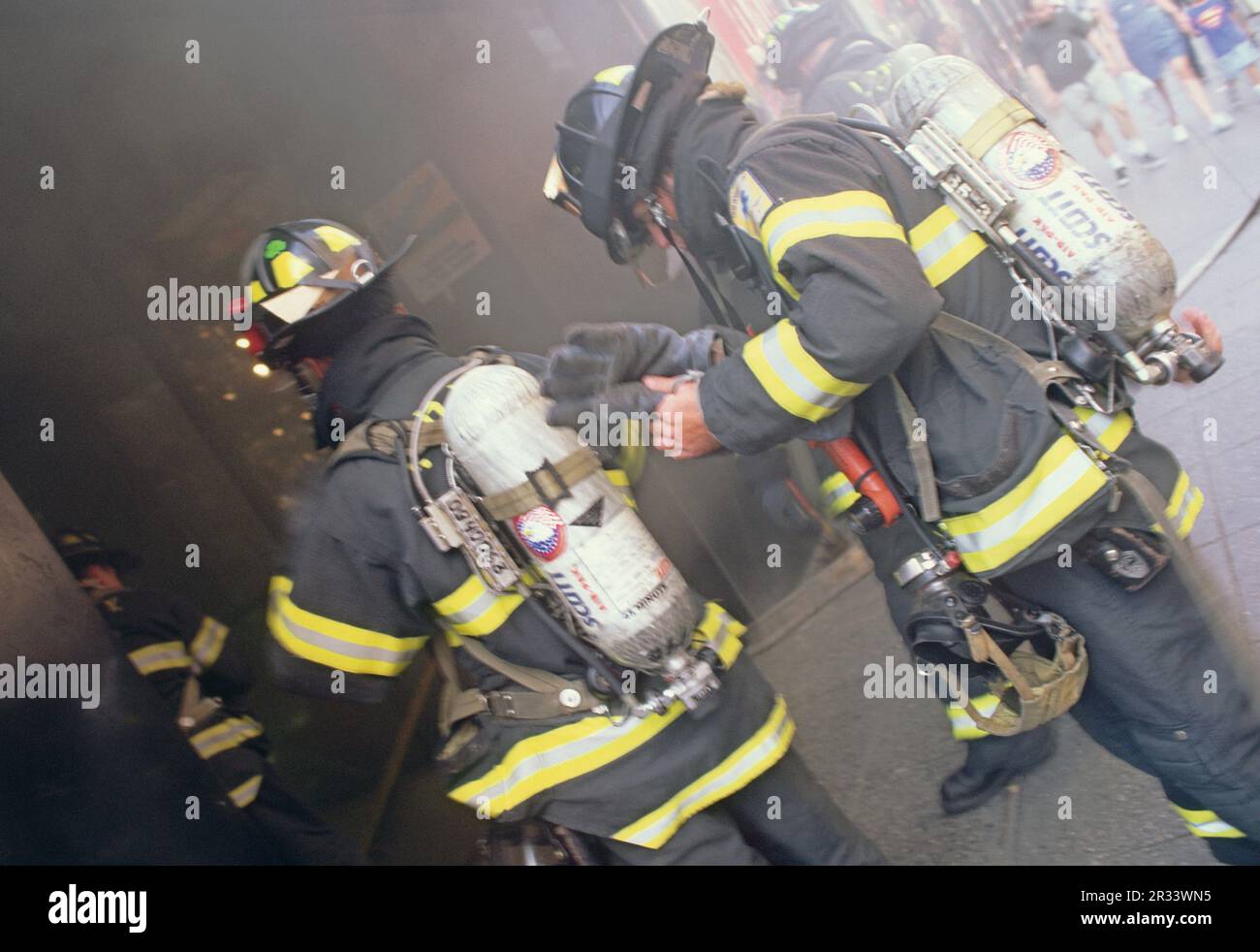 Subway fire. Firefighters or firemen close up (closeup) entering ...