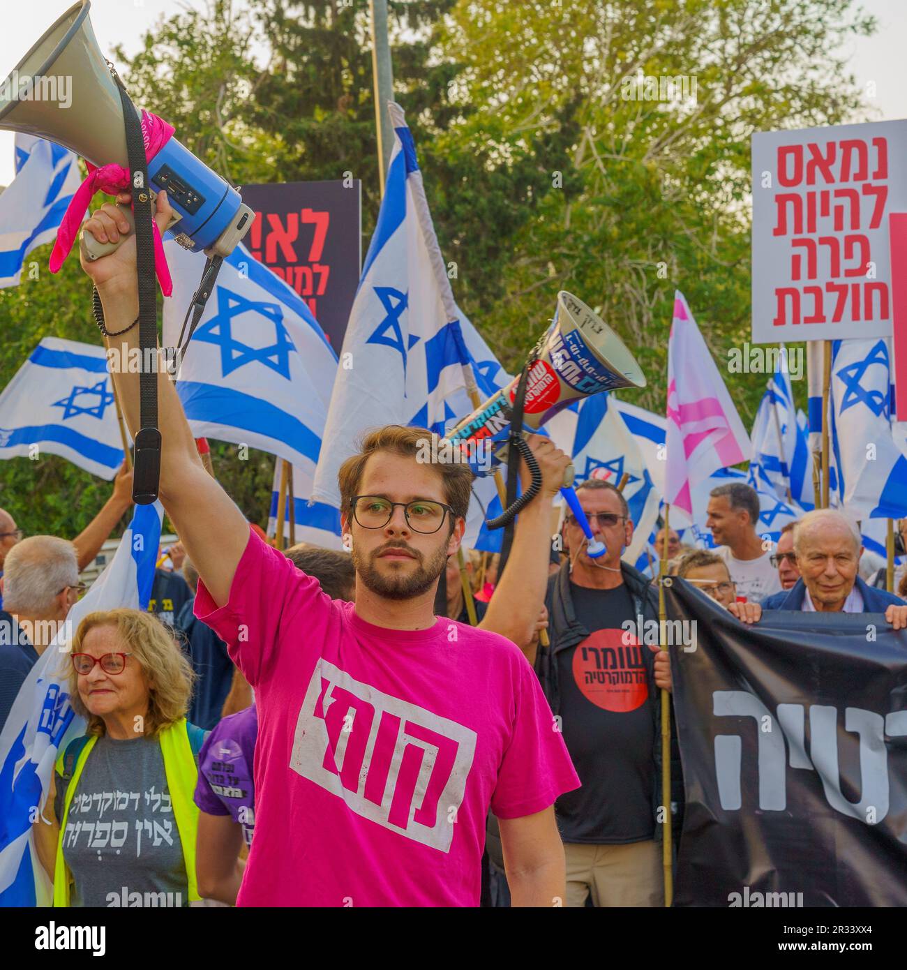 Haifa, Israel - May 20, 2023: People marching with flags and various ...
