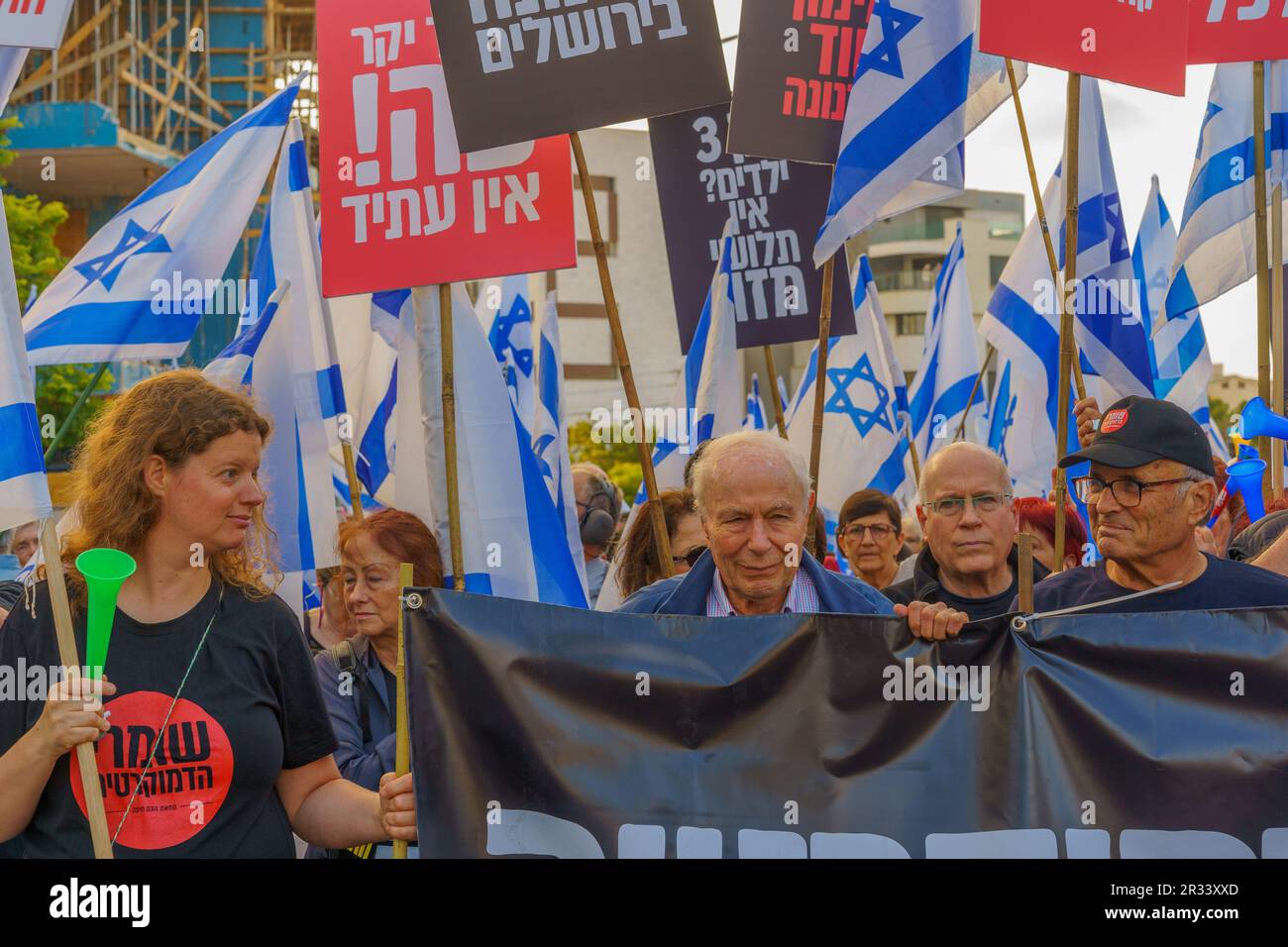 Haifa, Israel - May 20, 2023: People marching with flags and various ...