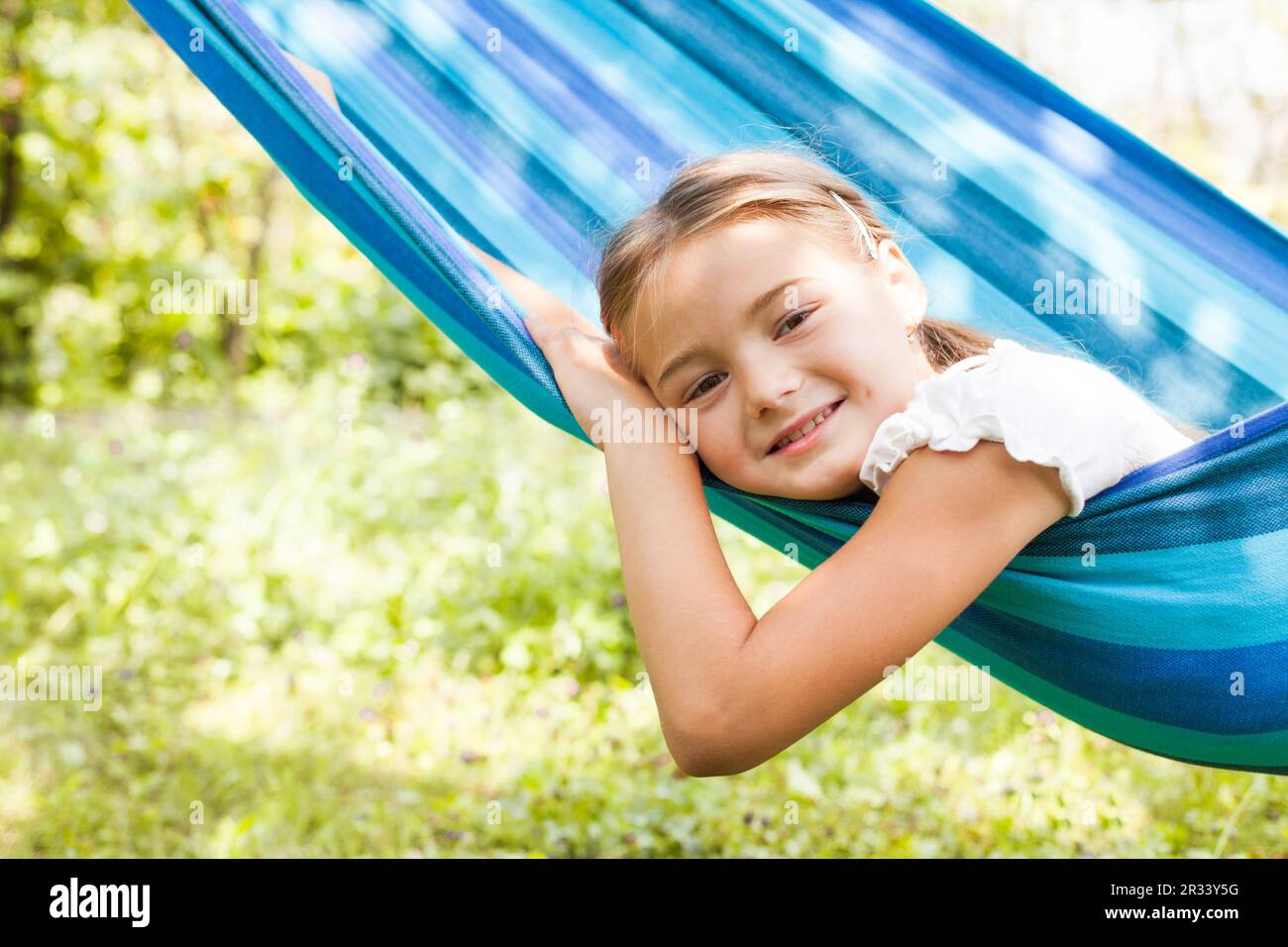 Girl on hammock Stock Photo - Alamy