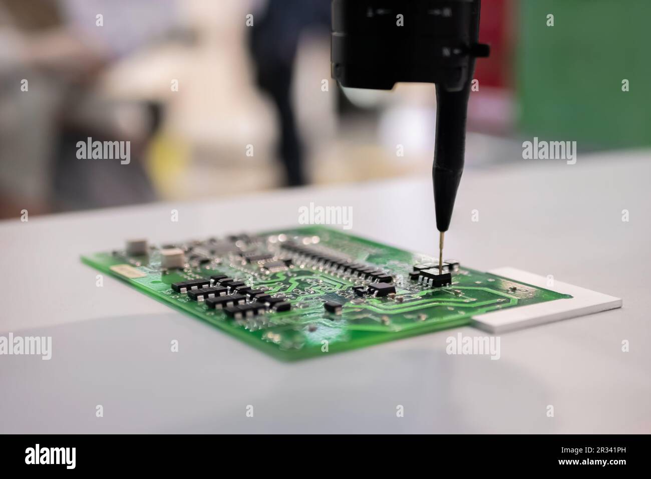 Automatic manipulator with dispenser needle during work with SMT pcb ...