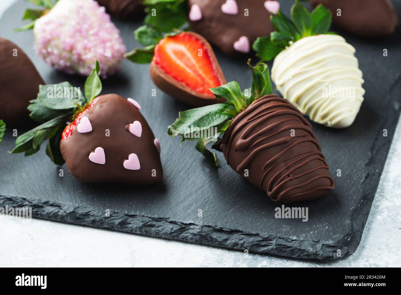 Gourmet chocolate covered strawberries on the light background Stock ...