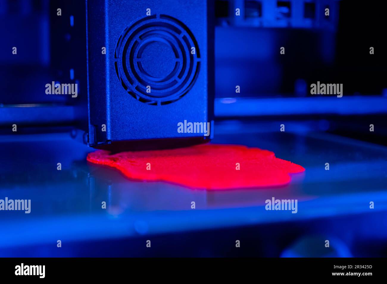 3D printer making physical red 3D model with plastic wire filament ...