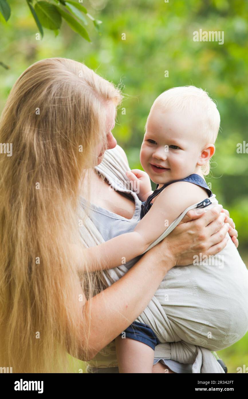 Baby in sling Stock Photo - Alamy