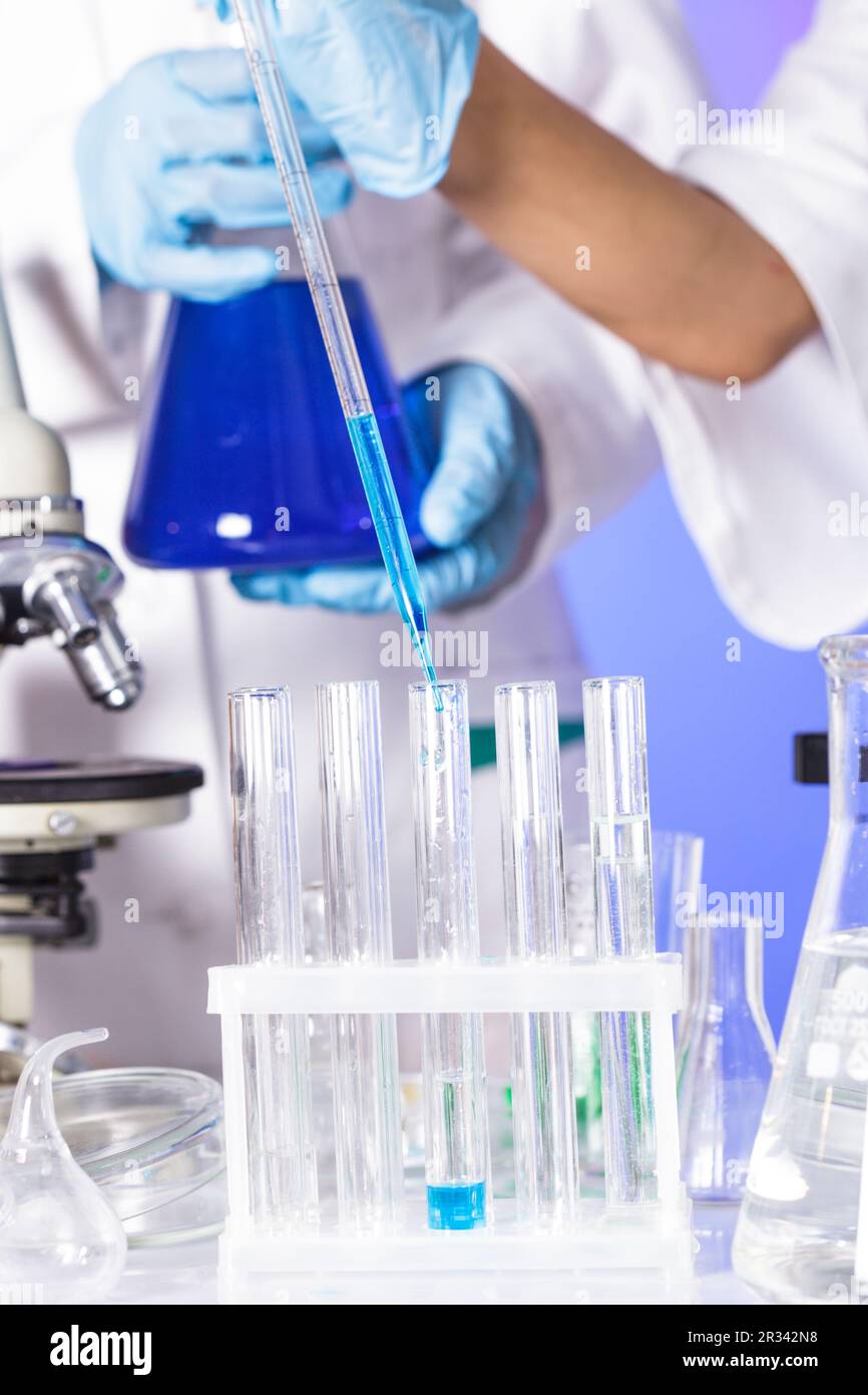 Laboratory glassware hands hi-res stock photography and images - Alamy