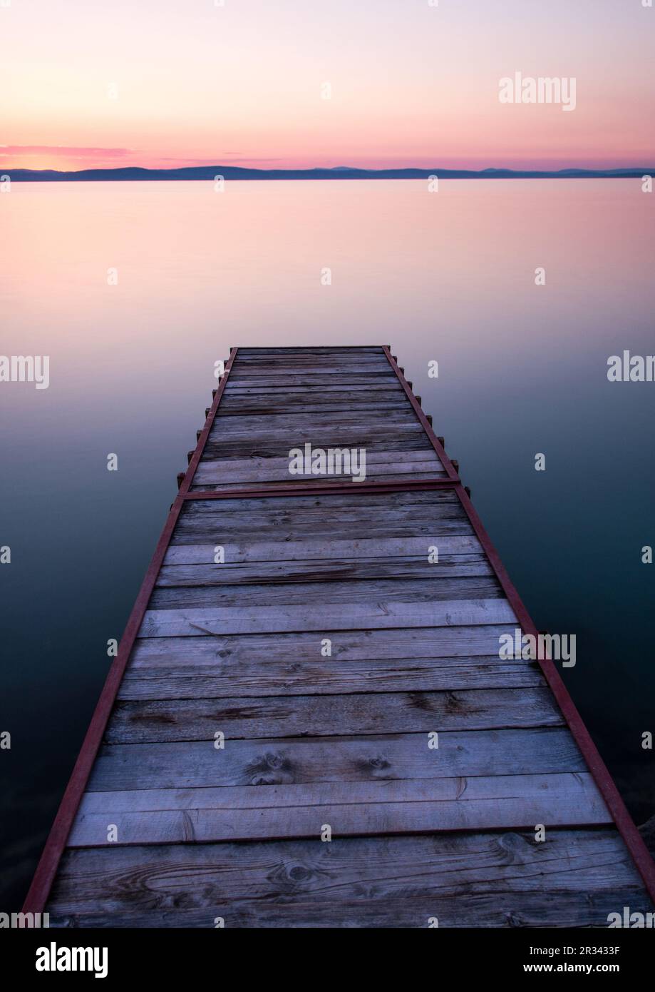 jetty at beach with sunset Stock Photo - Alamy