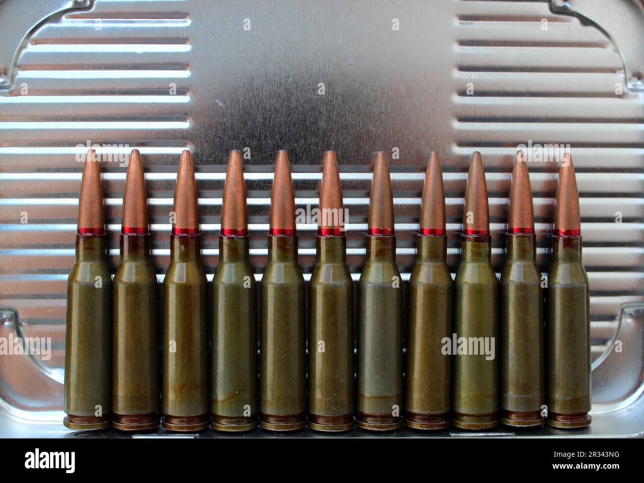 Eleven Bullets In A Row On Corrugated Metal Surface Texture Background ...