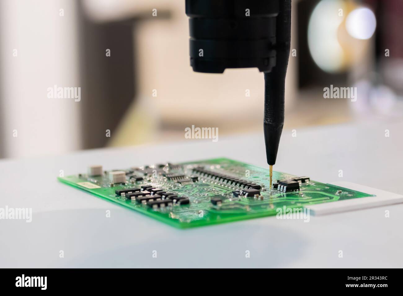 Automatic manipulator with dispenser needle during work with SMT pcb ...