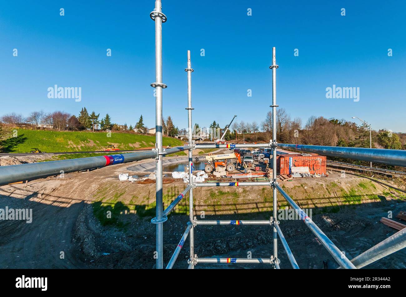 Construction site for highway ramp as seen from a man lift above ...