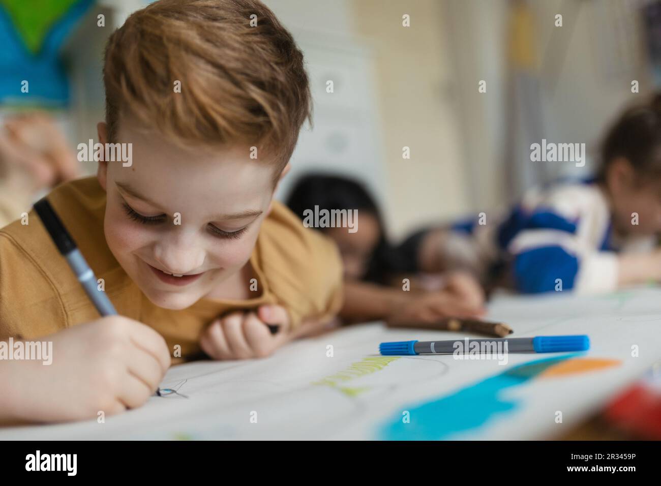 Portrait of young boy working on school project about wind energy Stock ...