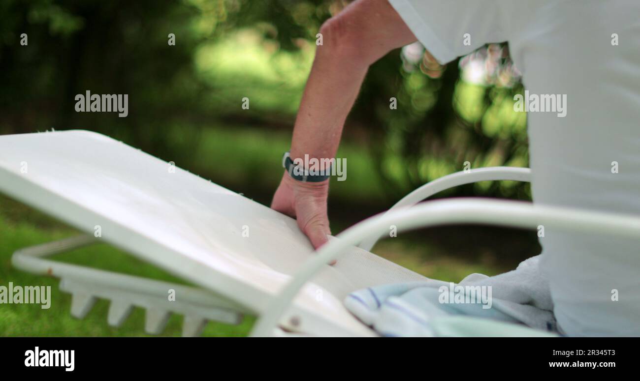 Retired person preparing to relax lying down in nature about to rest ...