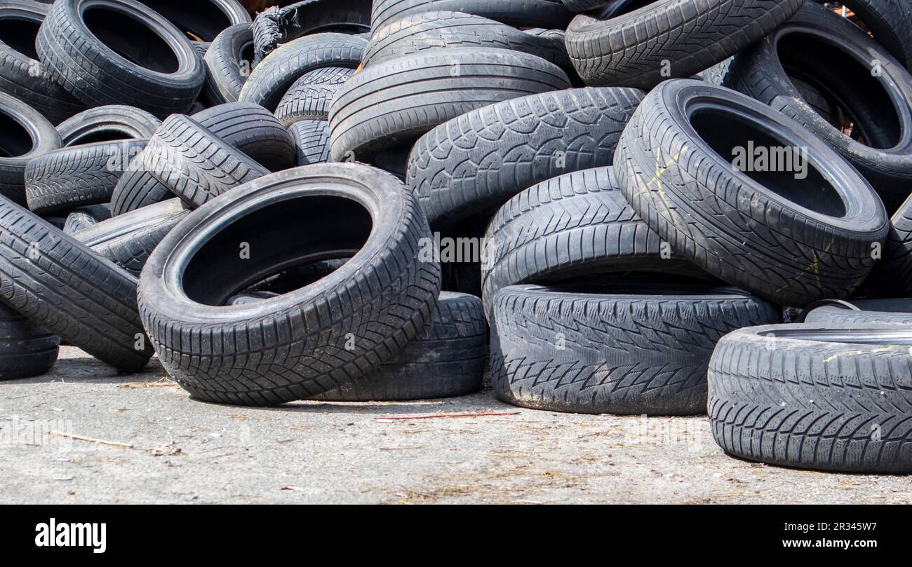 Garbage from a pile of black old car tires. Environmental pollution ...