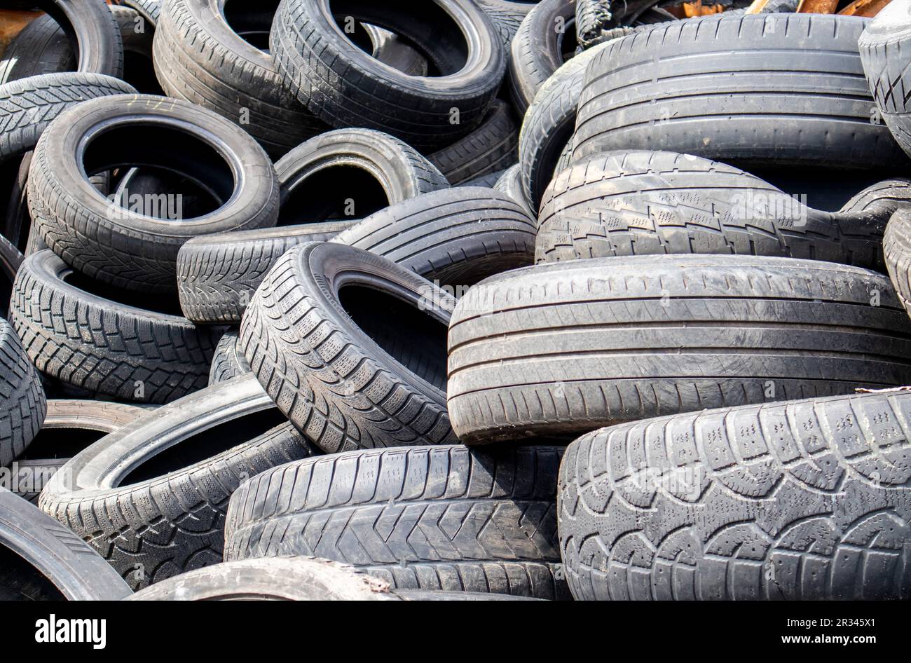 Garbage from a pile of black old car tires. Environmental pollution ...