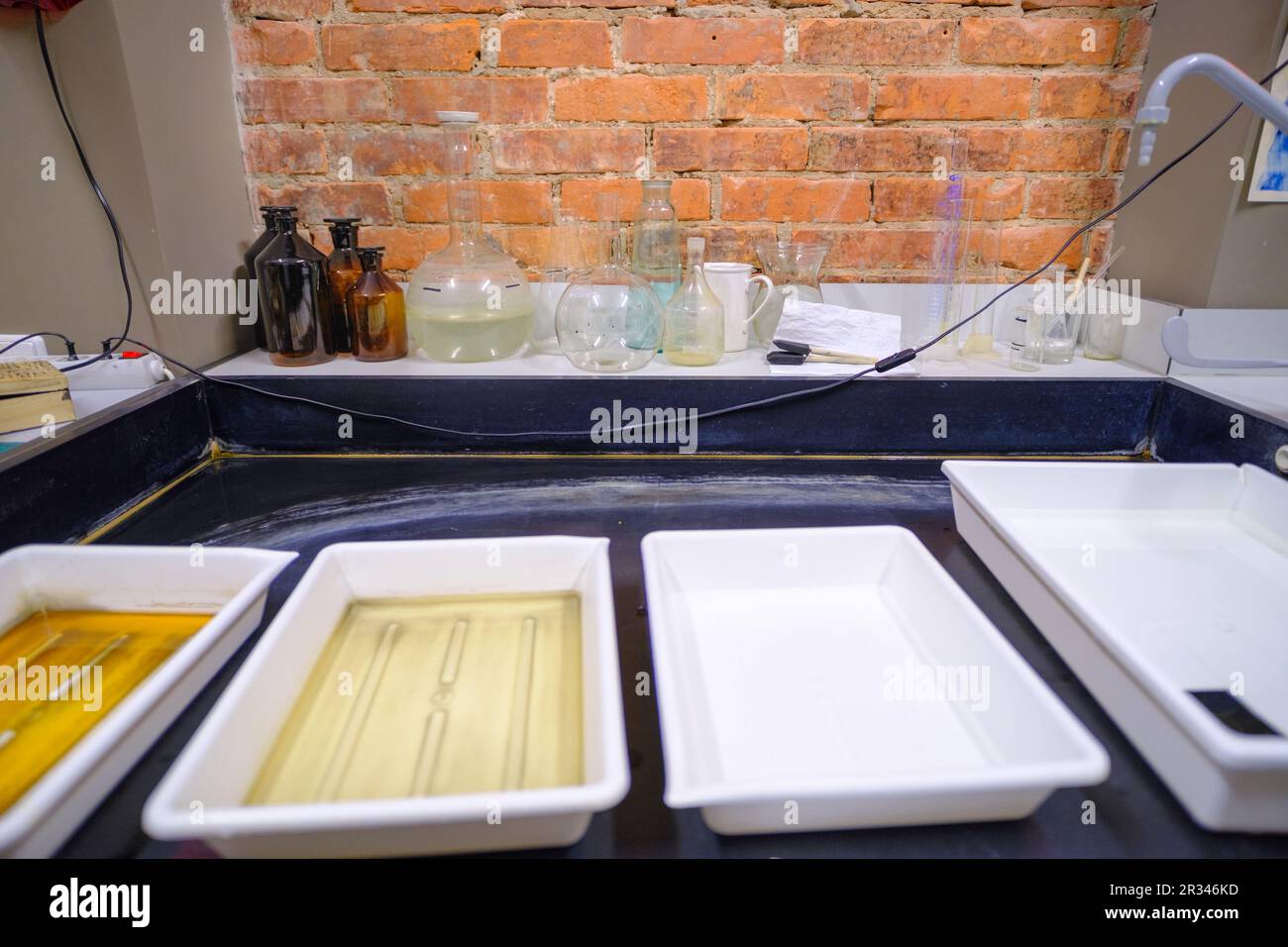 Development tank with chemistry. Rolls of photographic film, cassette ...