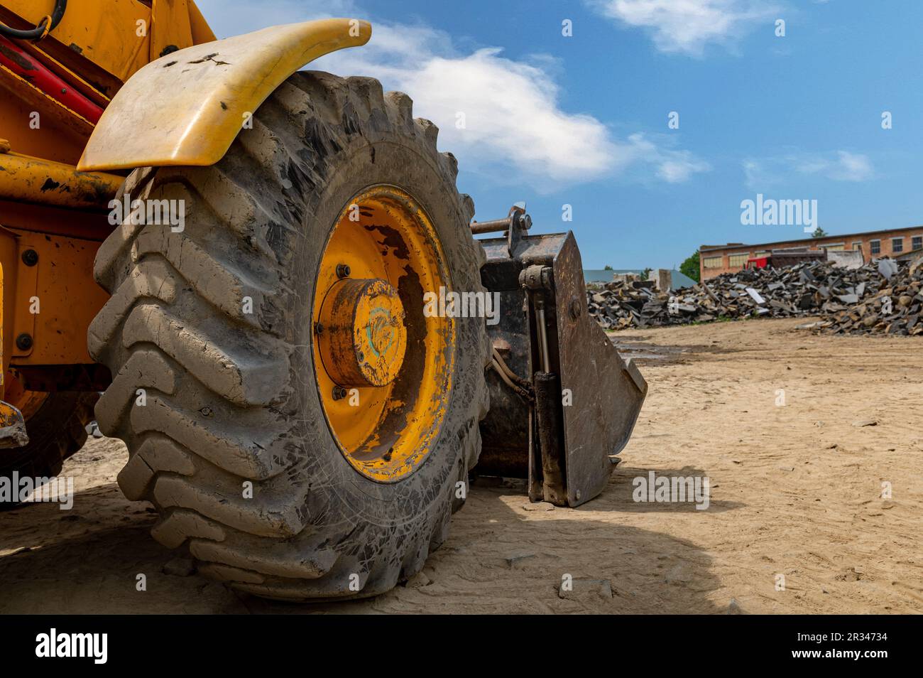 Details of modern red tractor close up. Big bright yellow powerful ...