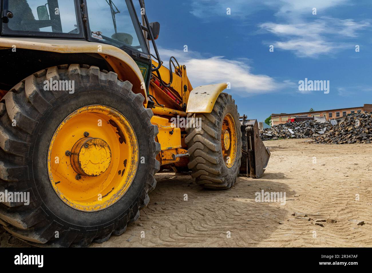 Details of modern red tractor close up. Big bright yellow powerful ...