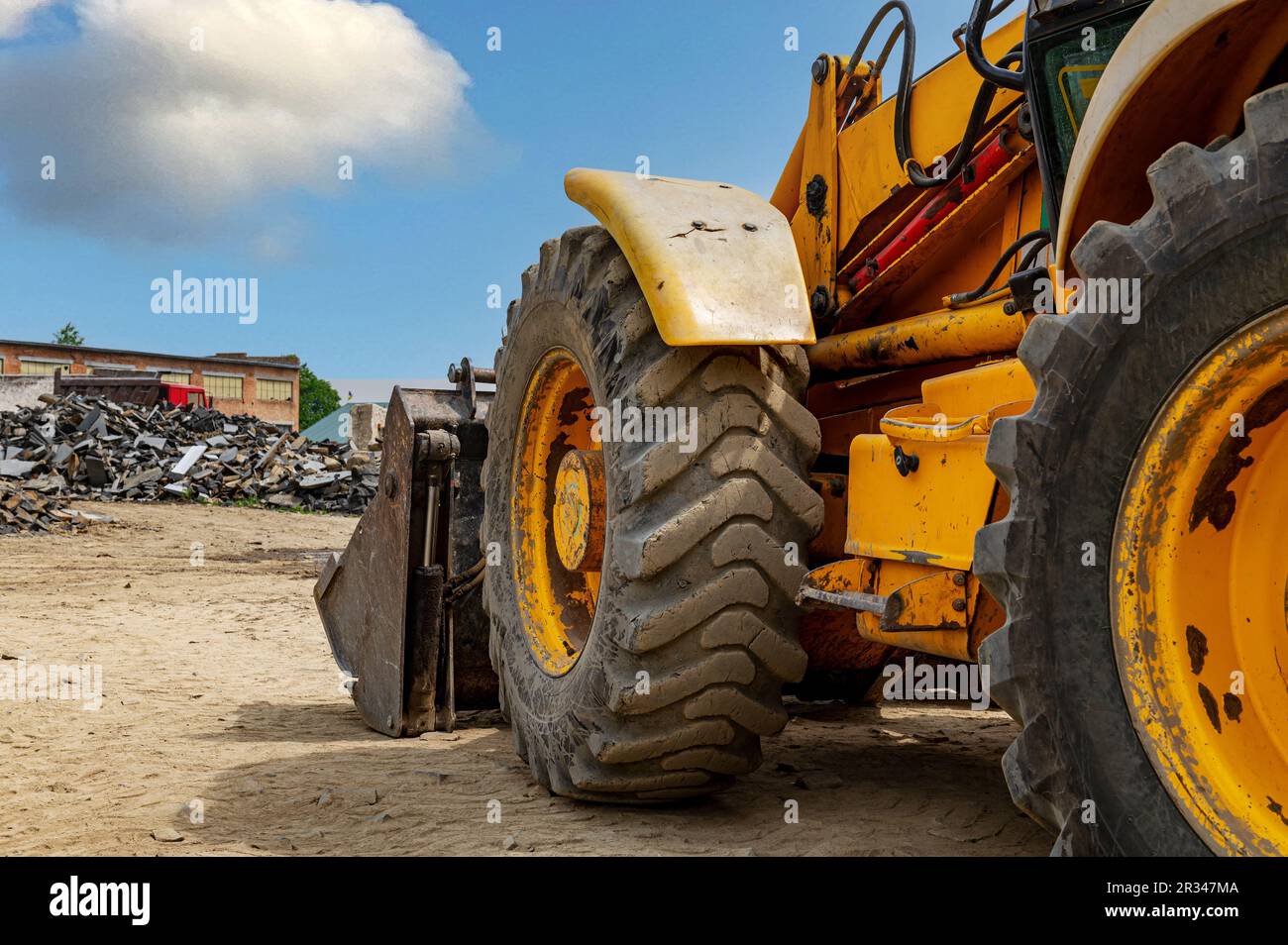 Details of modern red tractor close up. Big bright yellow powerful ...