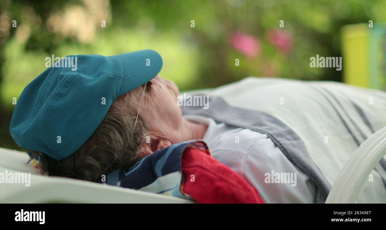 Person napping outdoors older man hi-res stock photography and images ...