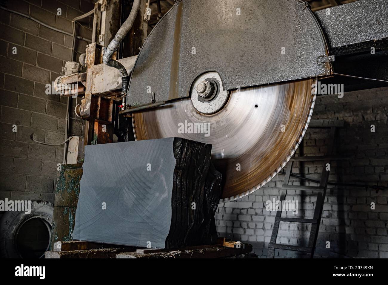 Saw for cutting granite. Large cutter cuts granite. Stone processing ...