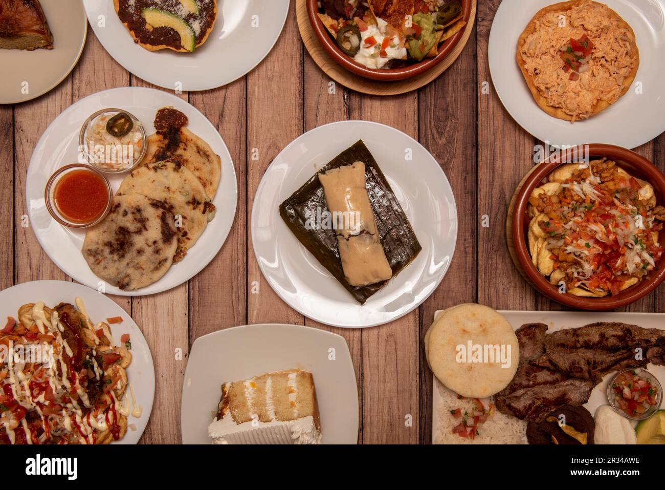 Set of Latin American and fusion food dishes with tamales, potatoes ...